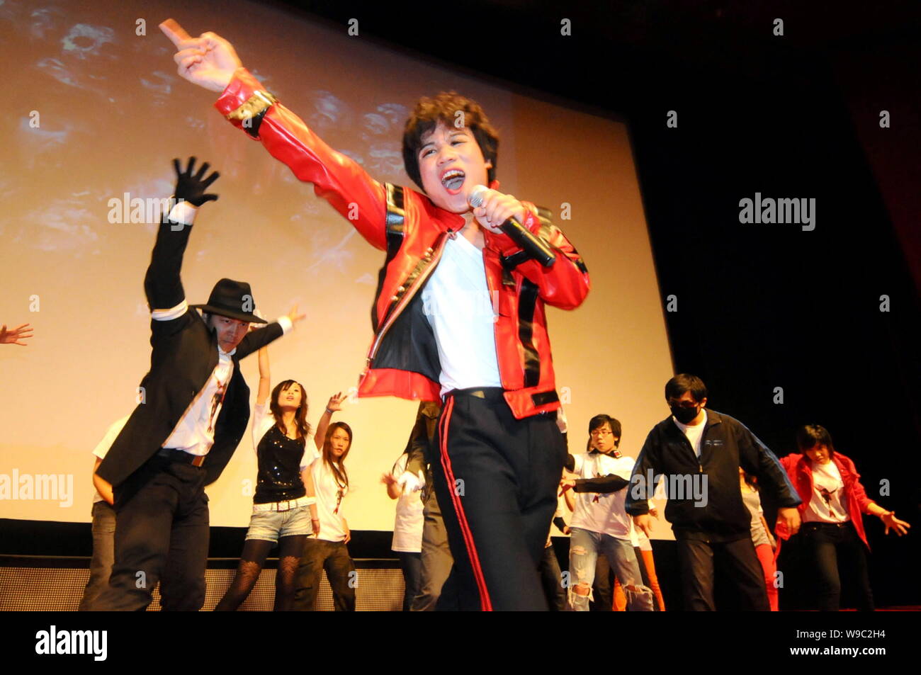 Chinese dancers imitating Michael Jackson perform during a ...