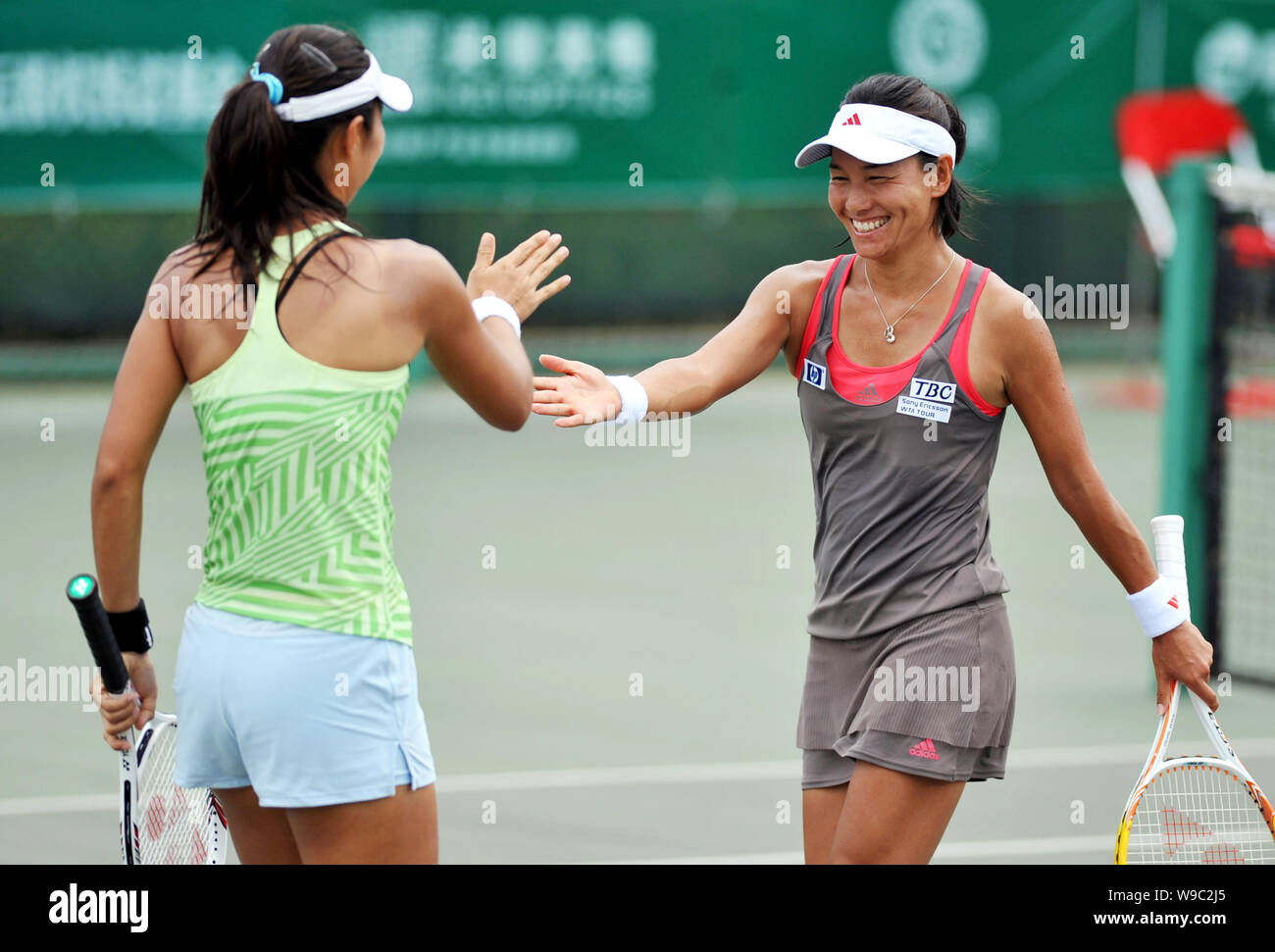 Kimiko Date Krumm of Japan, right, interacts with Chinas Sun Tiantian ...