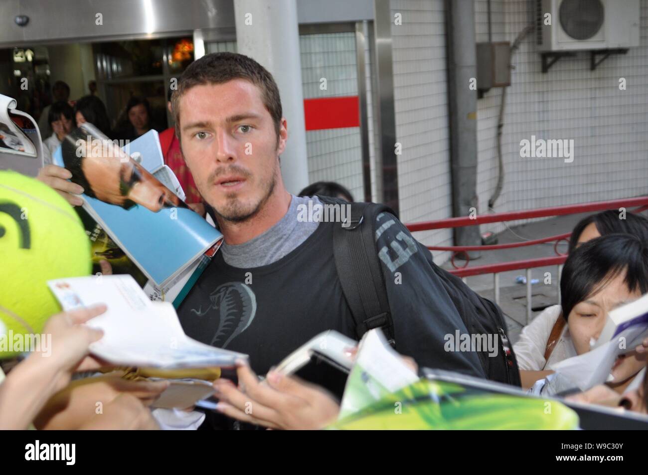 Russian tennis player Marat Safin is surrounded by fans after arriving ...