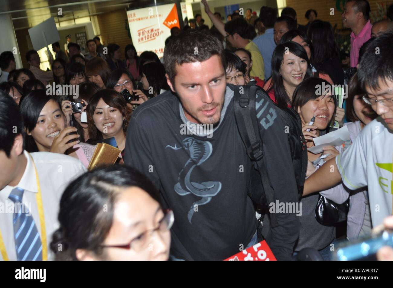 Russian tennis player Marat Safin is surrounded by fans after arriving ...