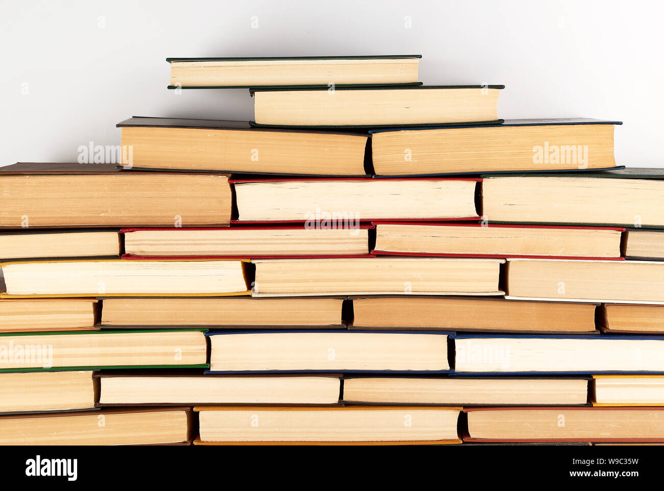 Piles of school text books hi-res stock photography and images - Alamy