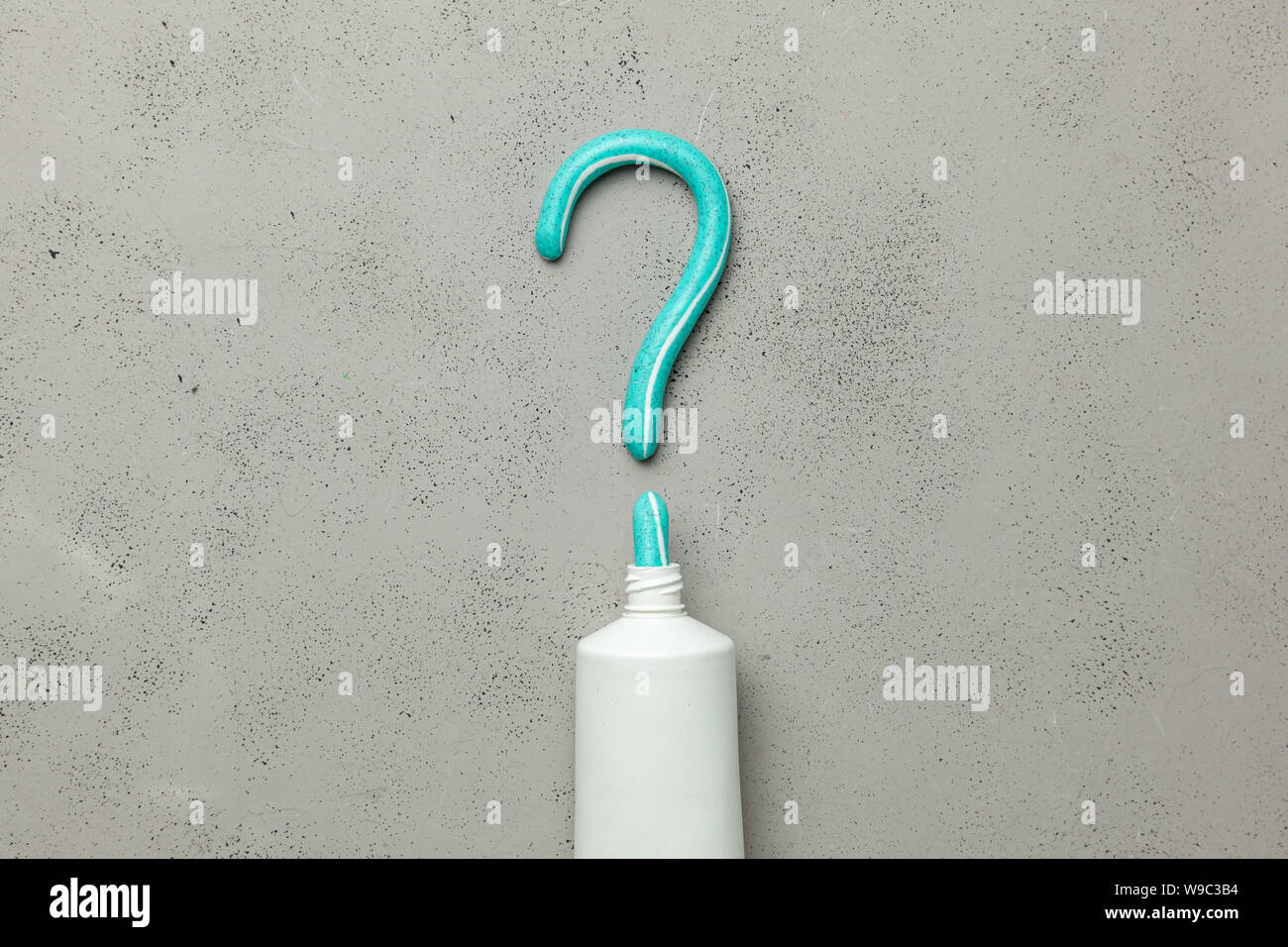 Toothpaste in the shape of a question mark. Concept of how to choose a ...