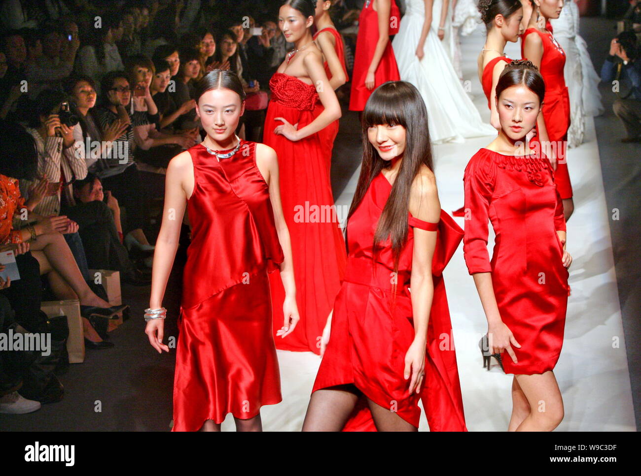 Models parade to display wedding gowns designed by Jenny Ji at the La ...