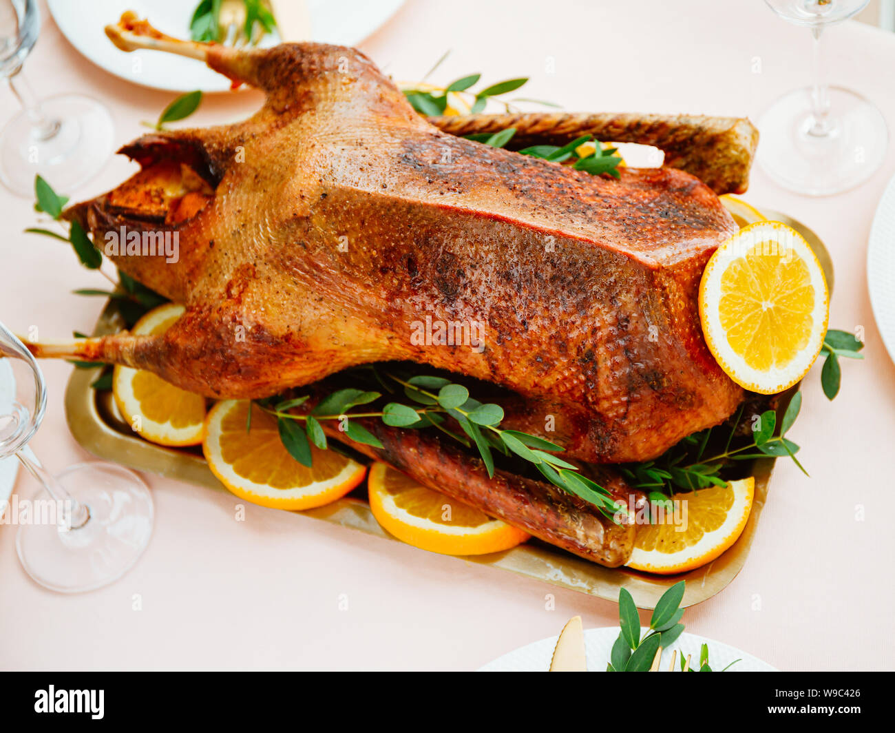 Roasted goose with oranges on a golden tray for celebrate event ...