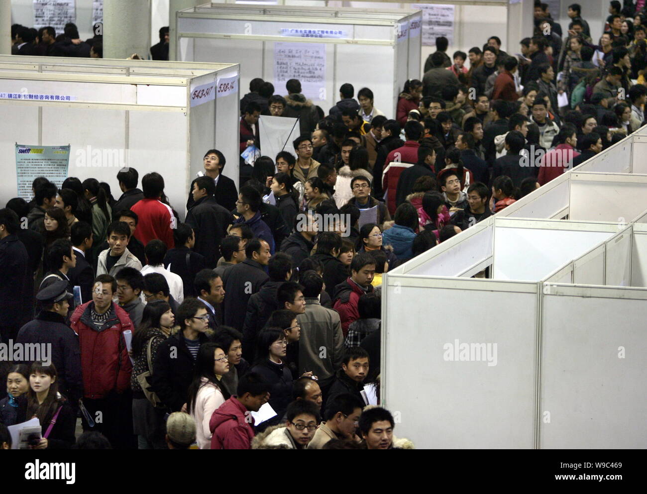 Chinese job seekers crowd stalls at a job fair in Nanjing city, east ...