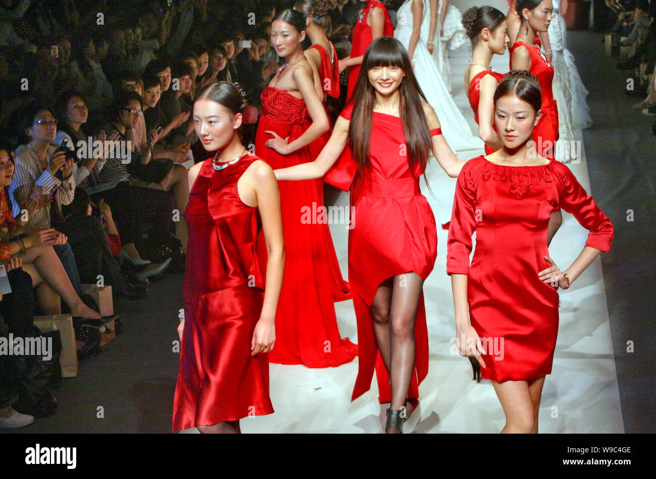 Models parade to display wedding gowns designed by Jenny Ji at the La ...