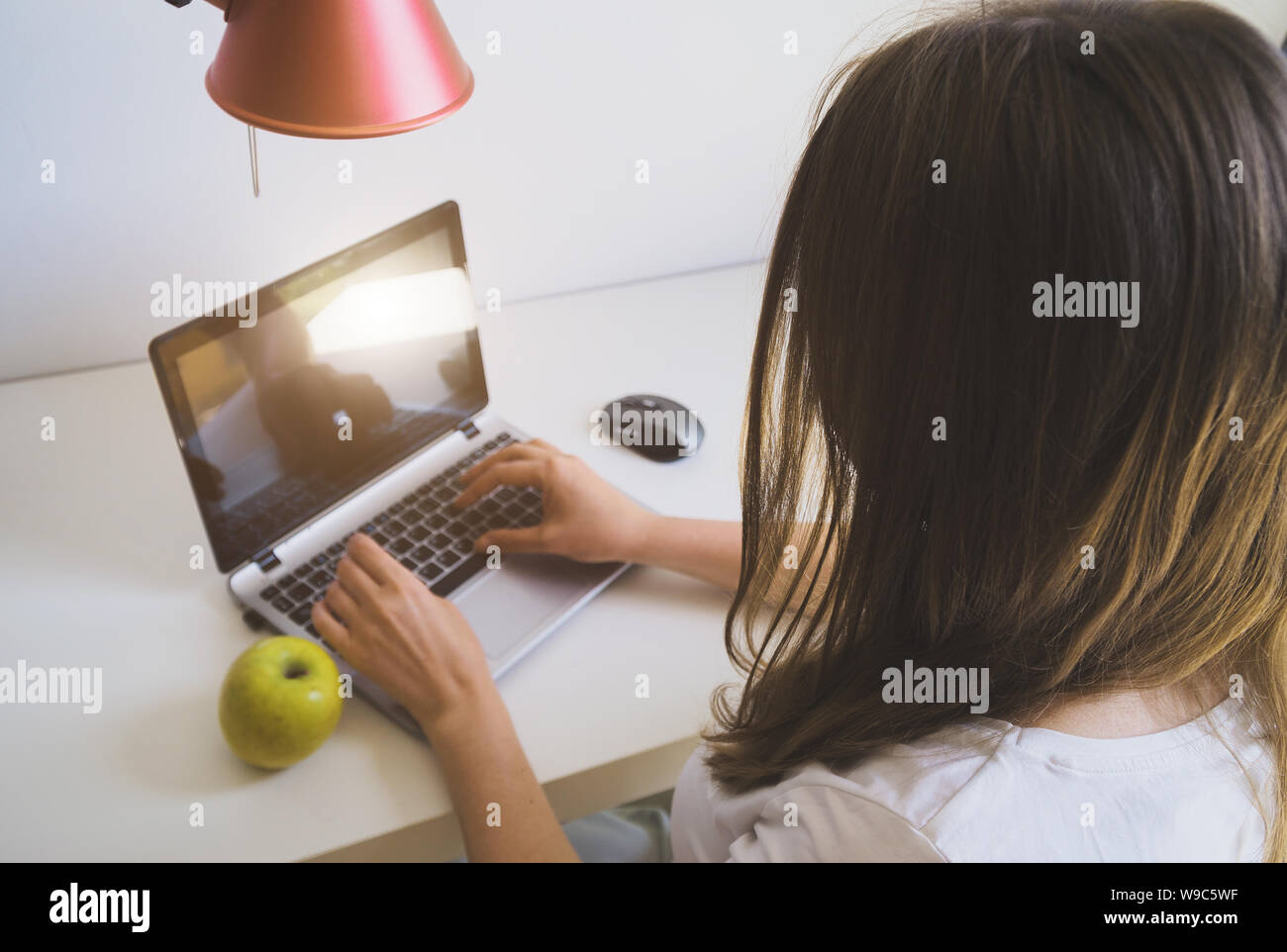 Rear view female hands typing hi-res stock photography and images - Alamy