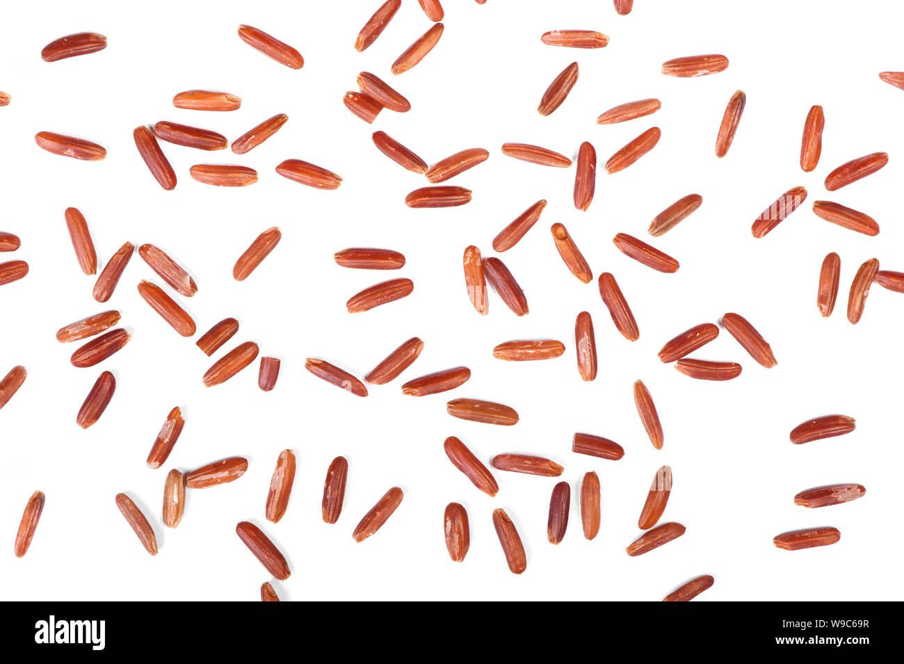 Scattered seeds of raw dry brown rice isolated on white background ...