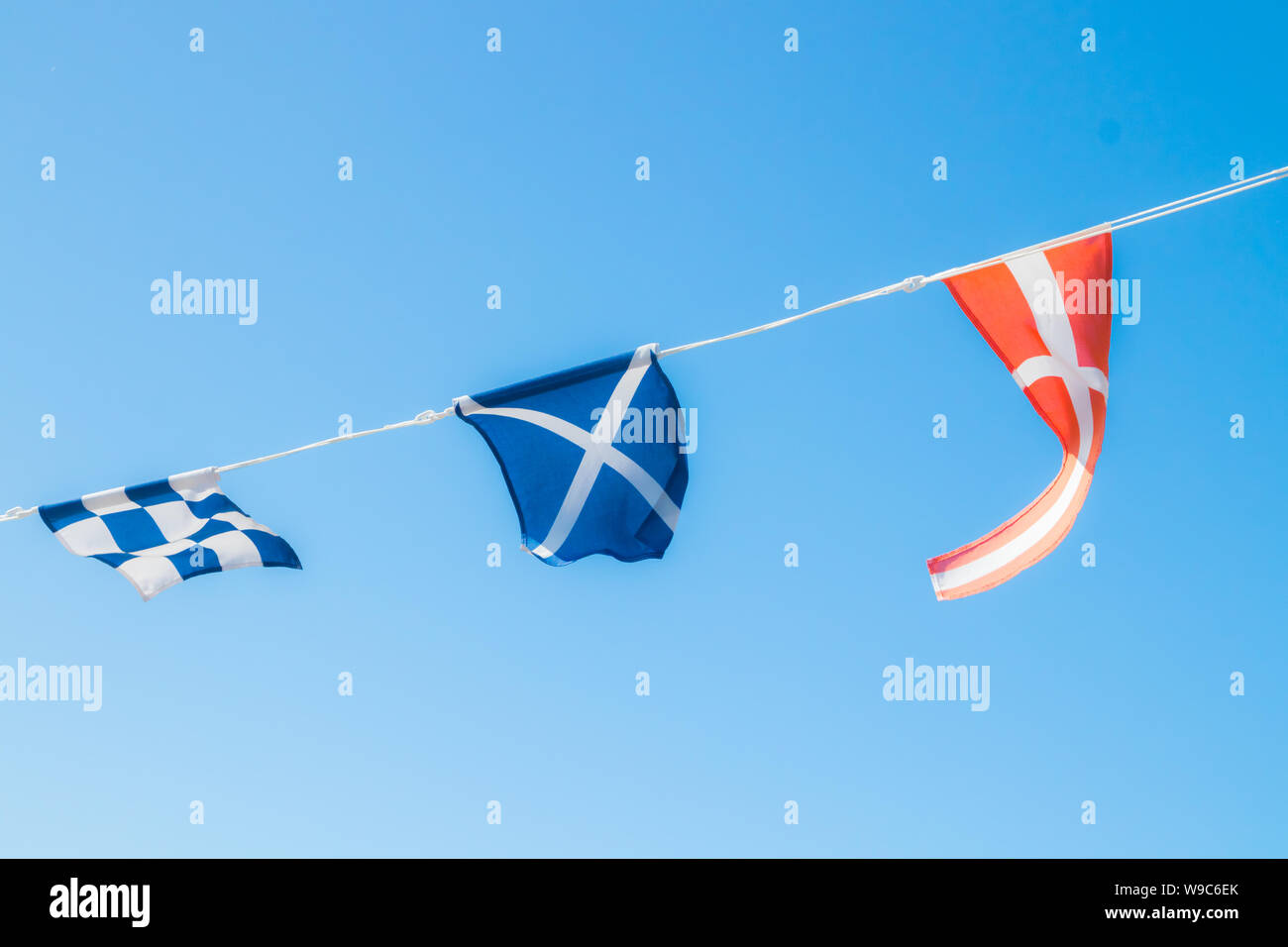 Nautical flags on the ship against blue sky Stock Photo - Alamy