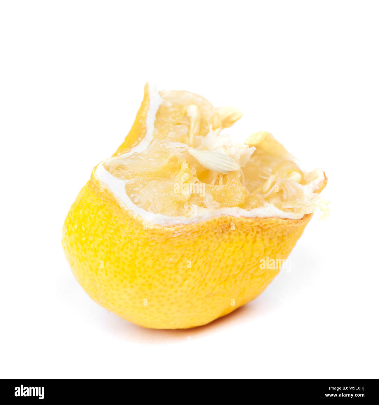 Piece of yellow dried lemon citrus fruit isolated on white background ...