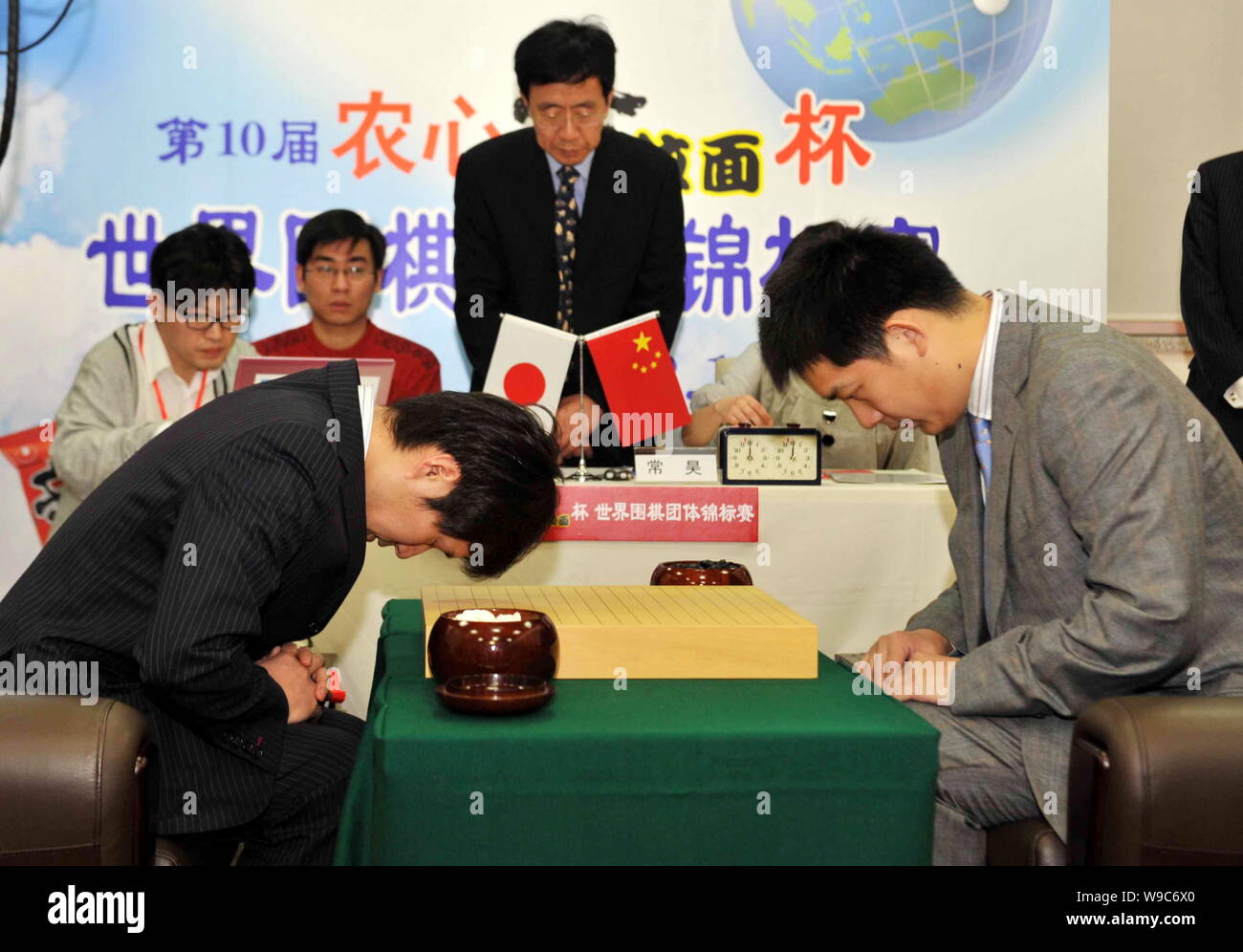 Chinas Chang Hao, right, and Japans Takao Shinji greet each other ...