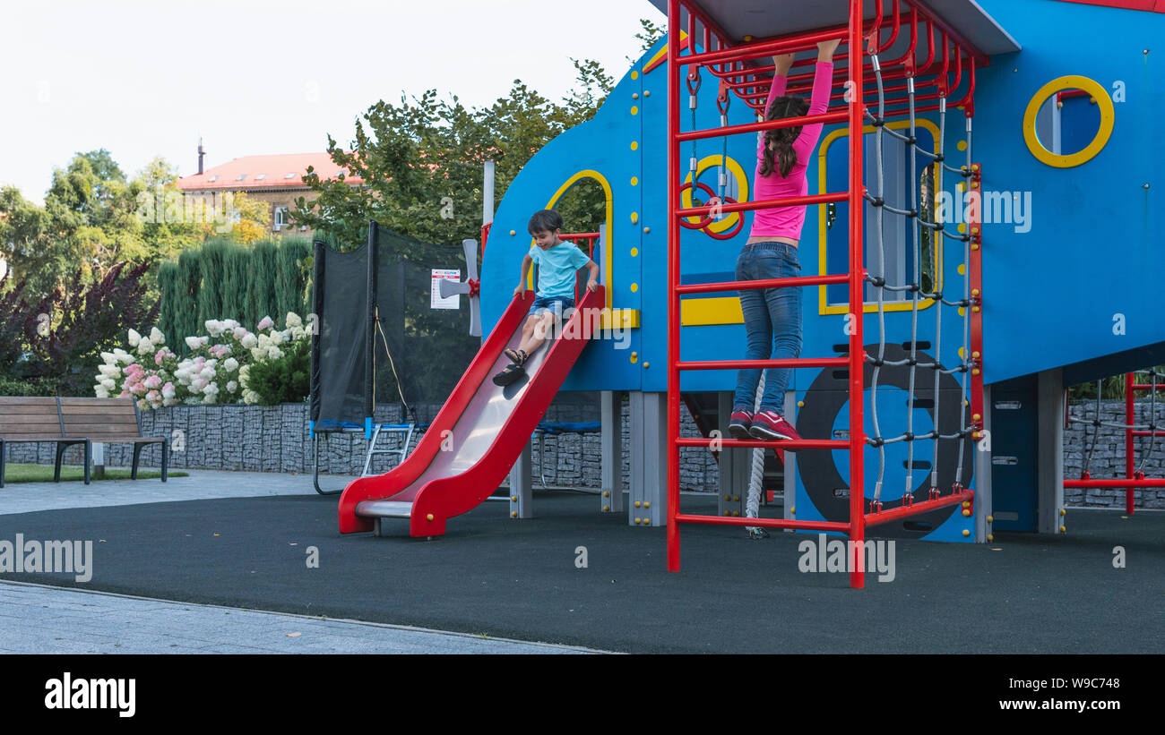Happy smiling child on playground. Happy kids playing outdoors, clear ...