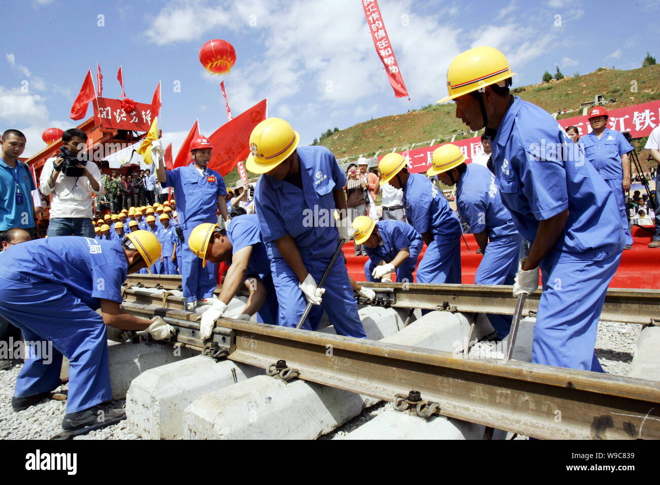 --FILE--Chinese workers pave rails at a construction site of Dali (Dali ...