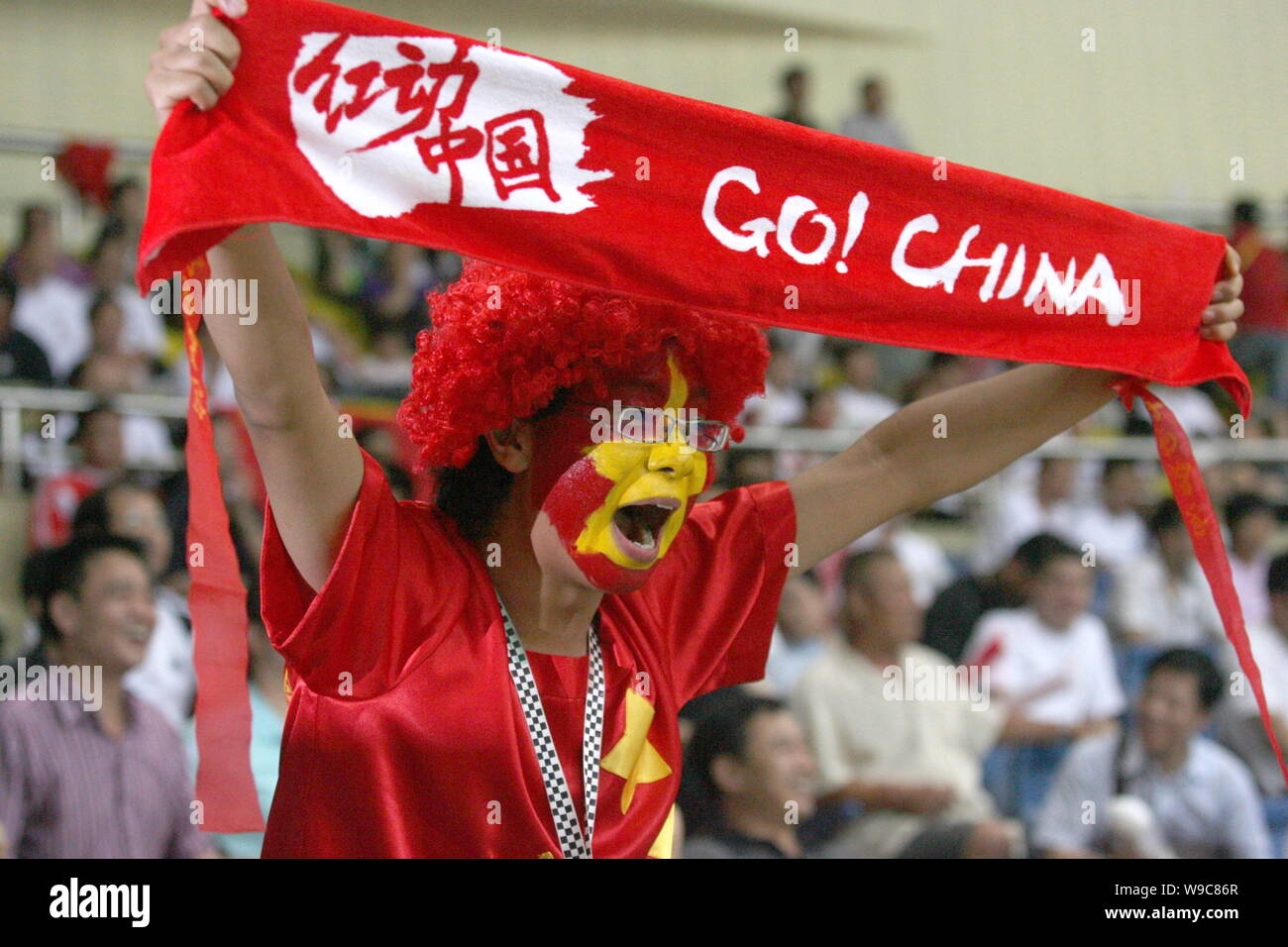 A Chinese basketball fan shouts to show support for the Chinese ...