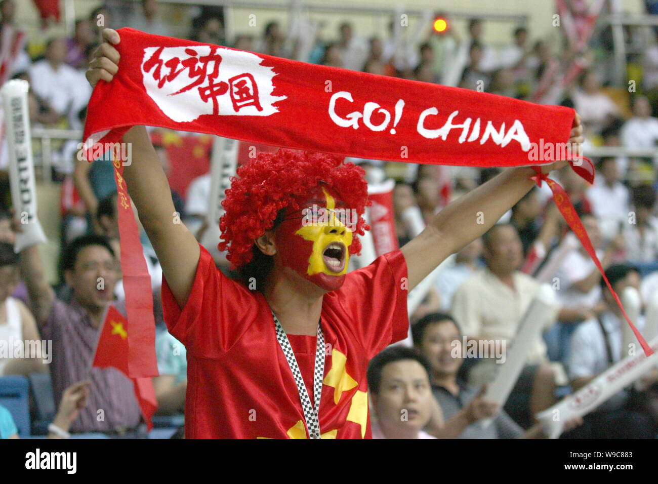 A Chinese basketball fan shouts to show support for the Chinese ...