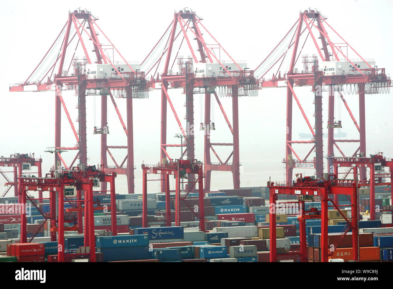 --FILE--Containers and container cranes are seen at a terminal of the ...