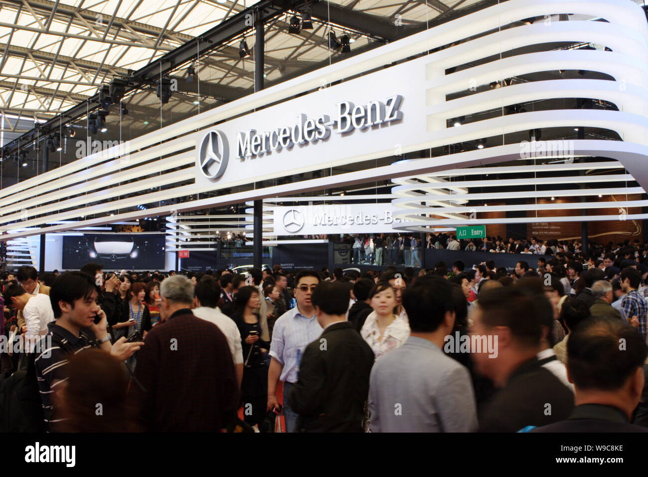 --FILE--Crowds of visitors are seen at the stand of Mercedes-Benz at ...
