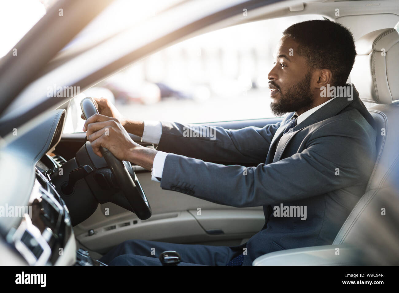 Test drive. Man examining new car outdoors Stock Photo - Alamy