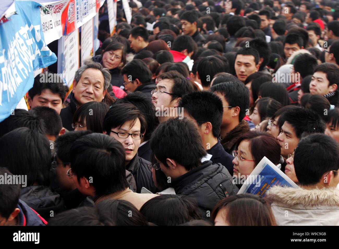 Chinese university and college graduates crowd stalls at a job fair in ...