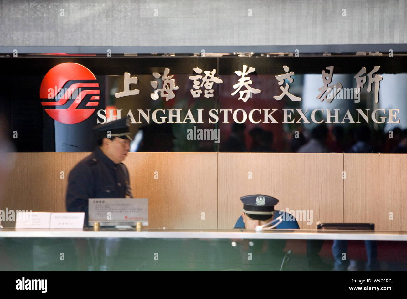 --FILE--Chinese security guards are seen at the Shanghai Stock Exchange ...