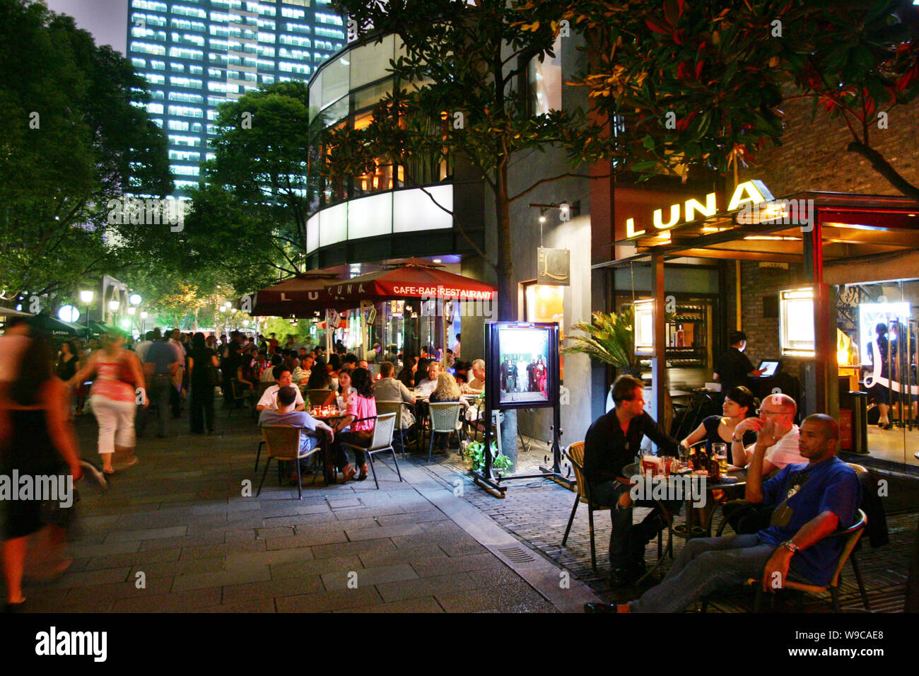 Customers eat and chat at Luna Cafe Bar Restaurant in Xintiandi, a ...