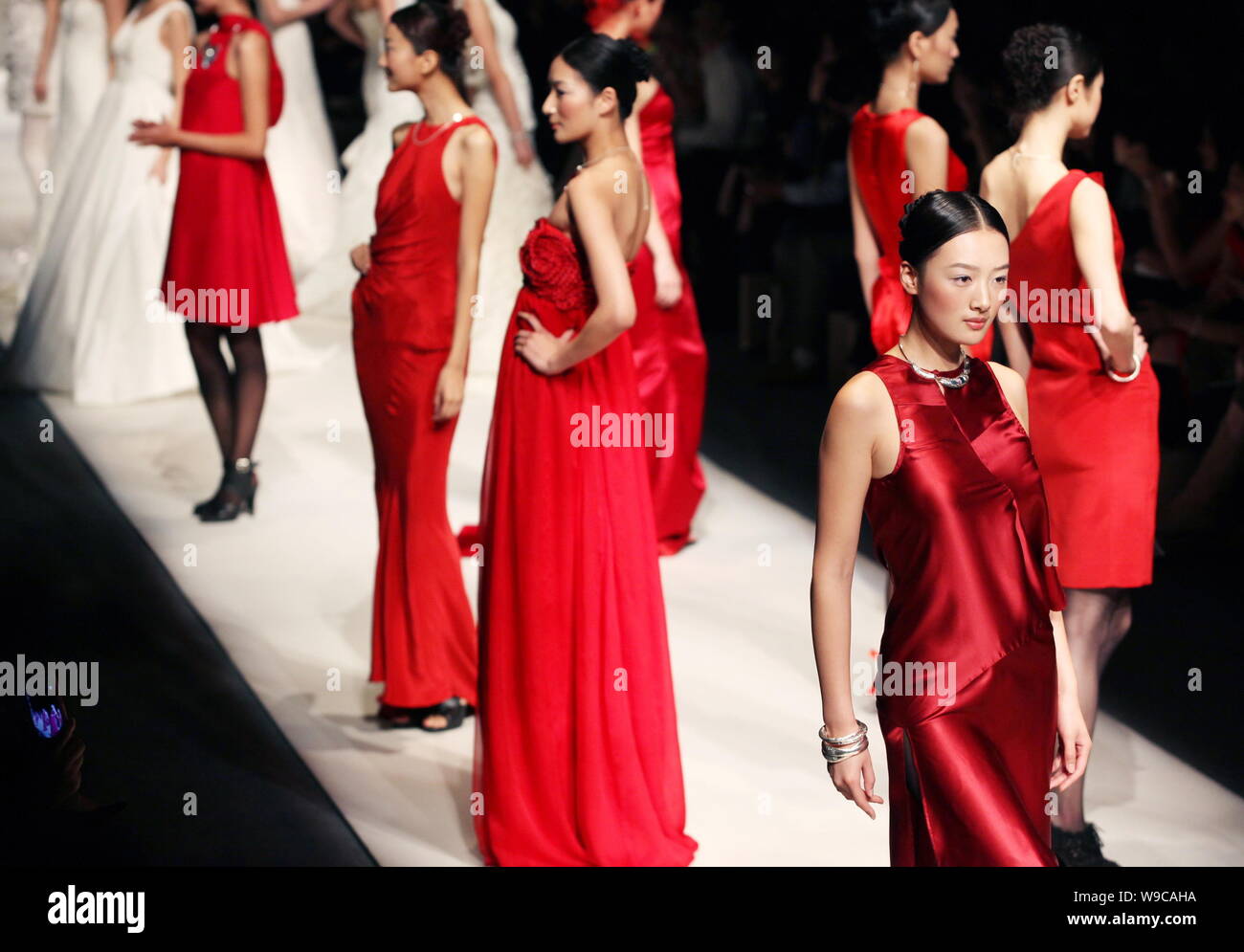 Models parade to display wedding gowns designed by Jenny Ji at the La ...