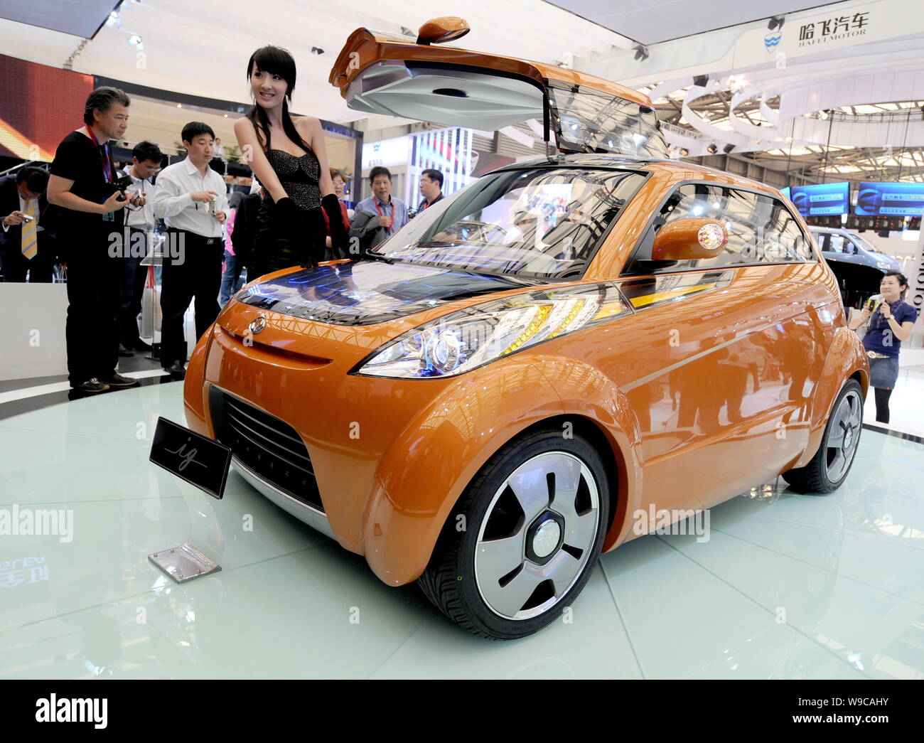 Visitors look at a Geely IG (Intelligent Geely) at the 13th Shanghai ...