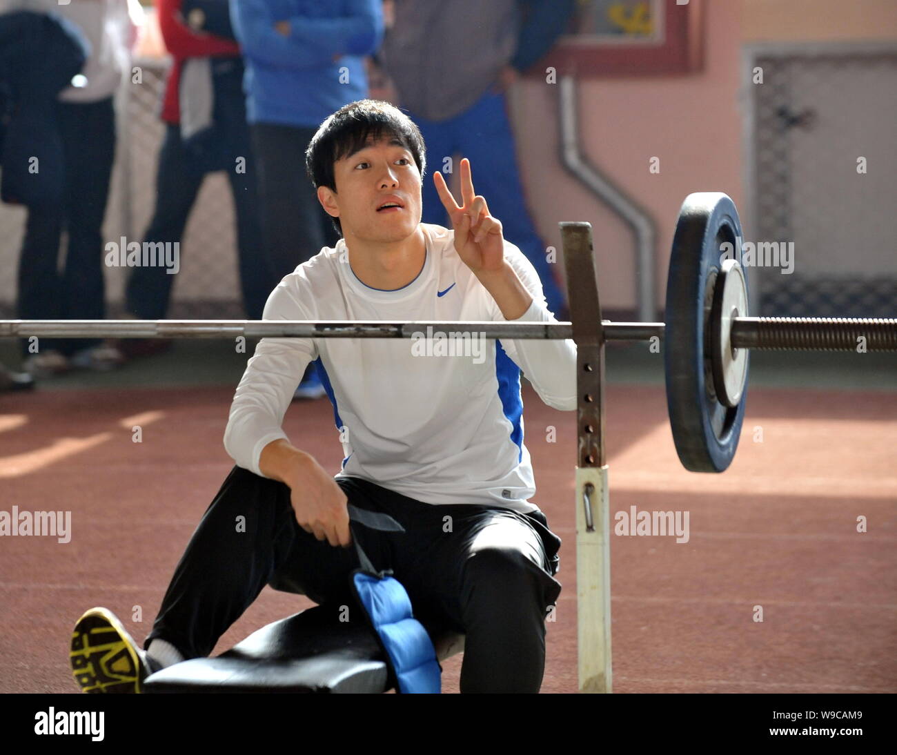 Chinese star hurdler Liu Xiang gestures during a training session at ...