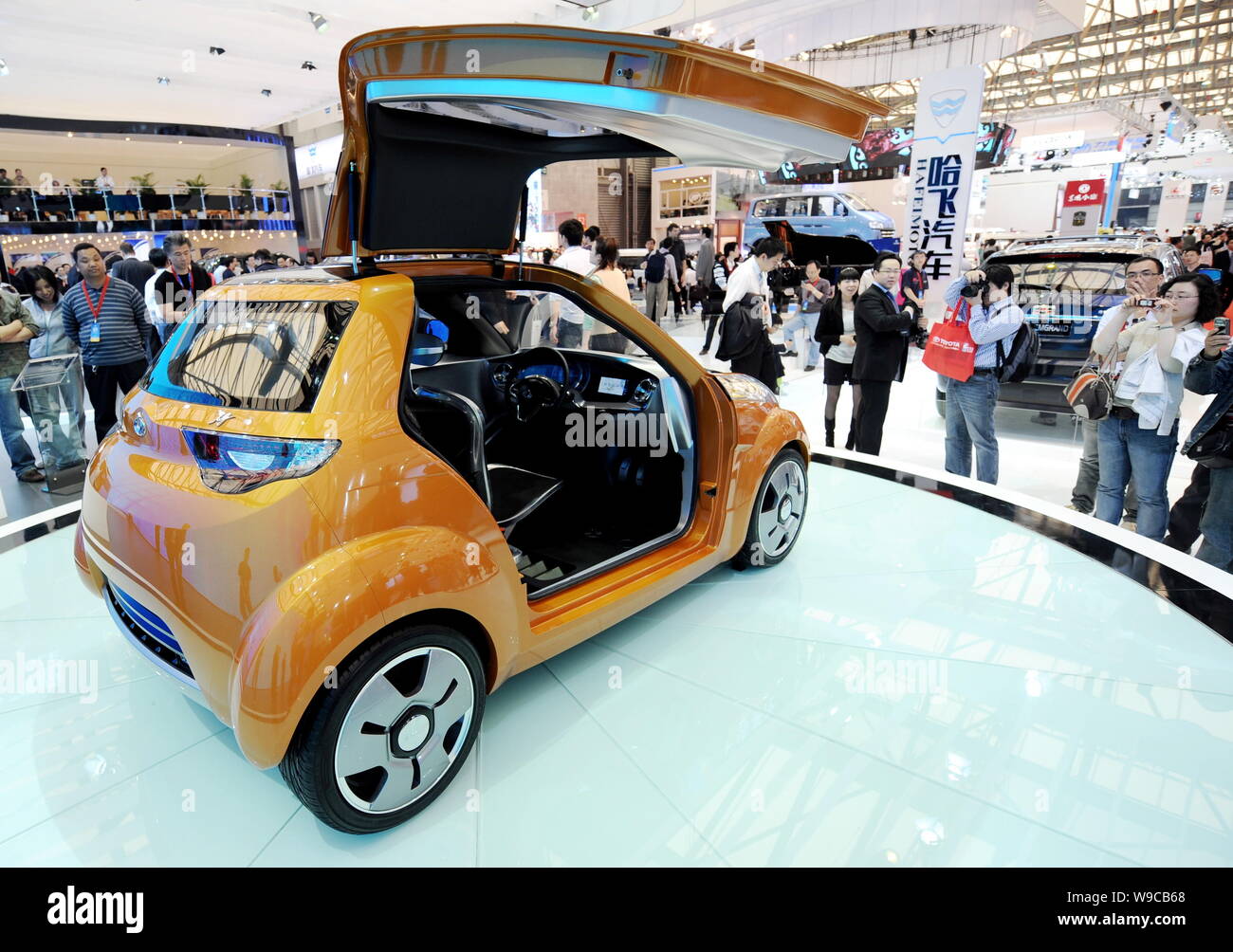 Visitors look at a Geely IG (Intelligent Geely) at the 13th Shanghai ...