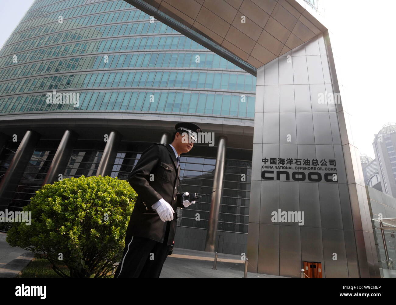 --FILE--A Chinese security stands guard at the entrance of the ...
