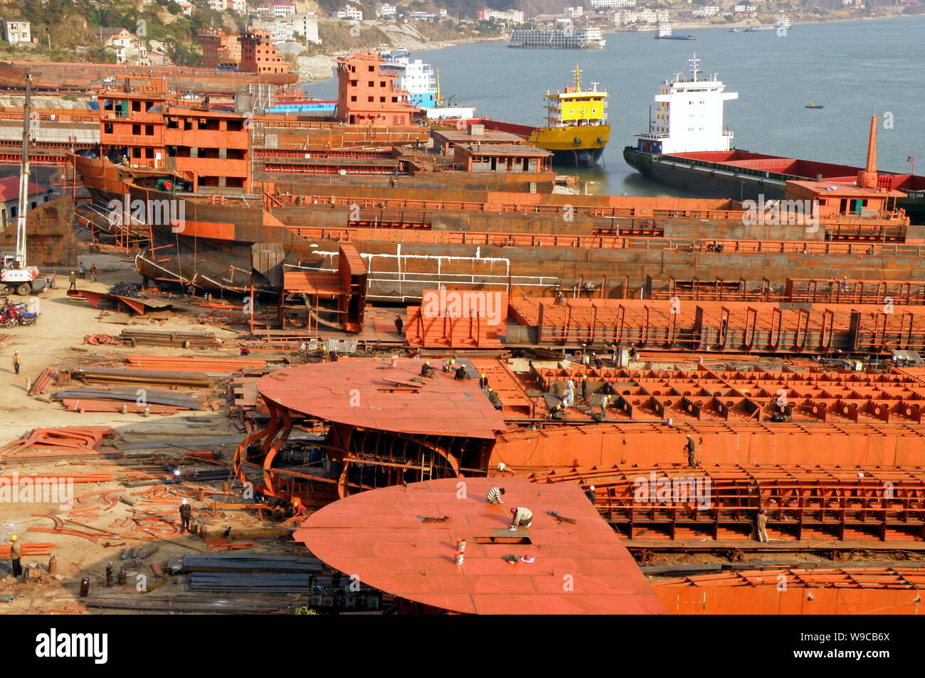 --FILE--Ships are seen being built at a shipyard beside the Yangtze ...