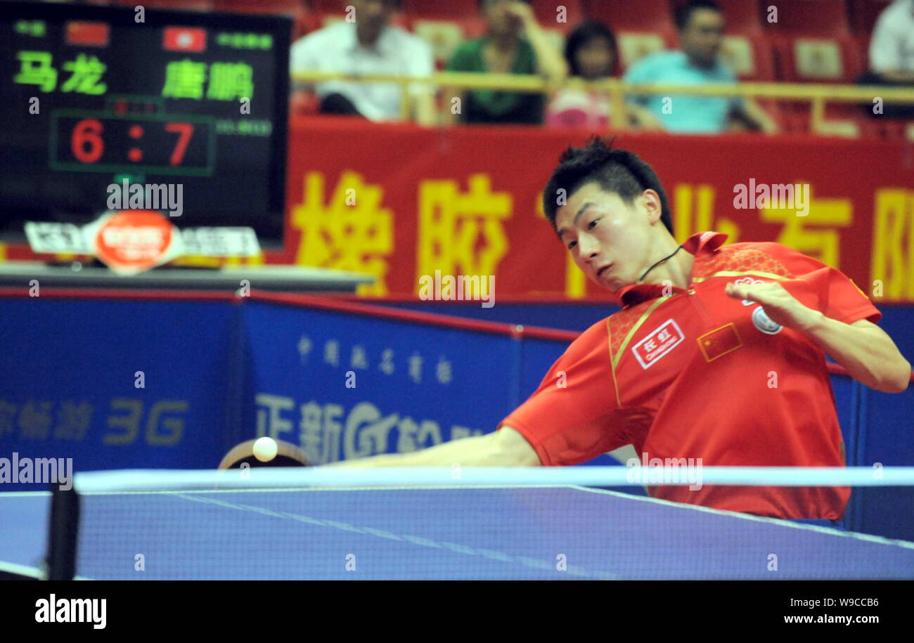 Chinas Ma Long competes against Tang Peng of Hong Kong, unseen, at the ...