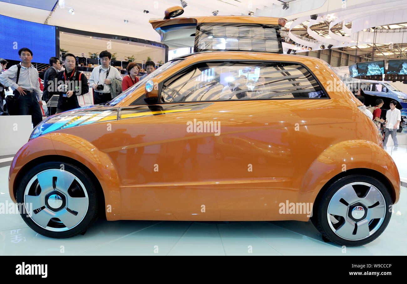 Visitors look at a Geely IG (Intelligent Geely) at the 13th Shanghai ...