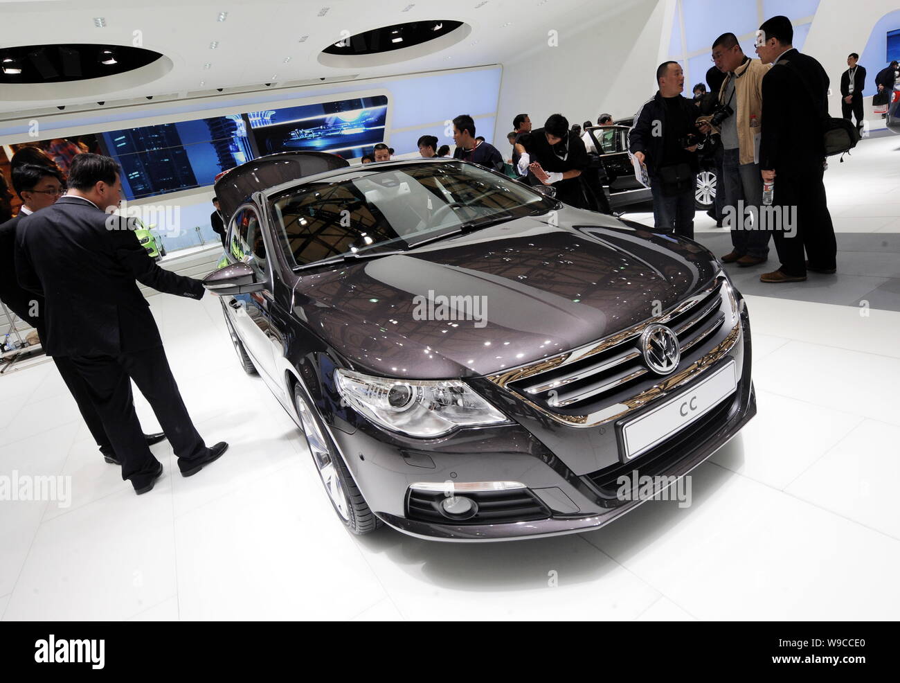--FILE--Visitors look at a Volkswagen Passat CC at the 13th Shanghai ...