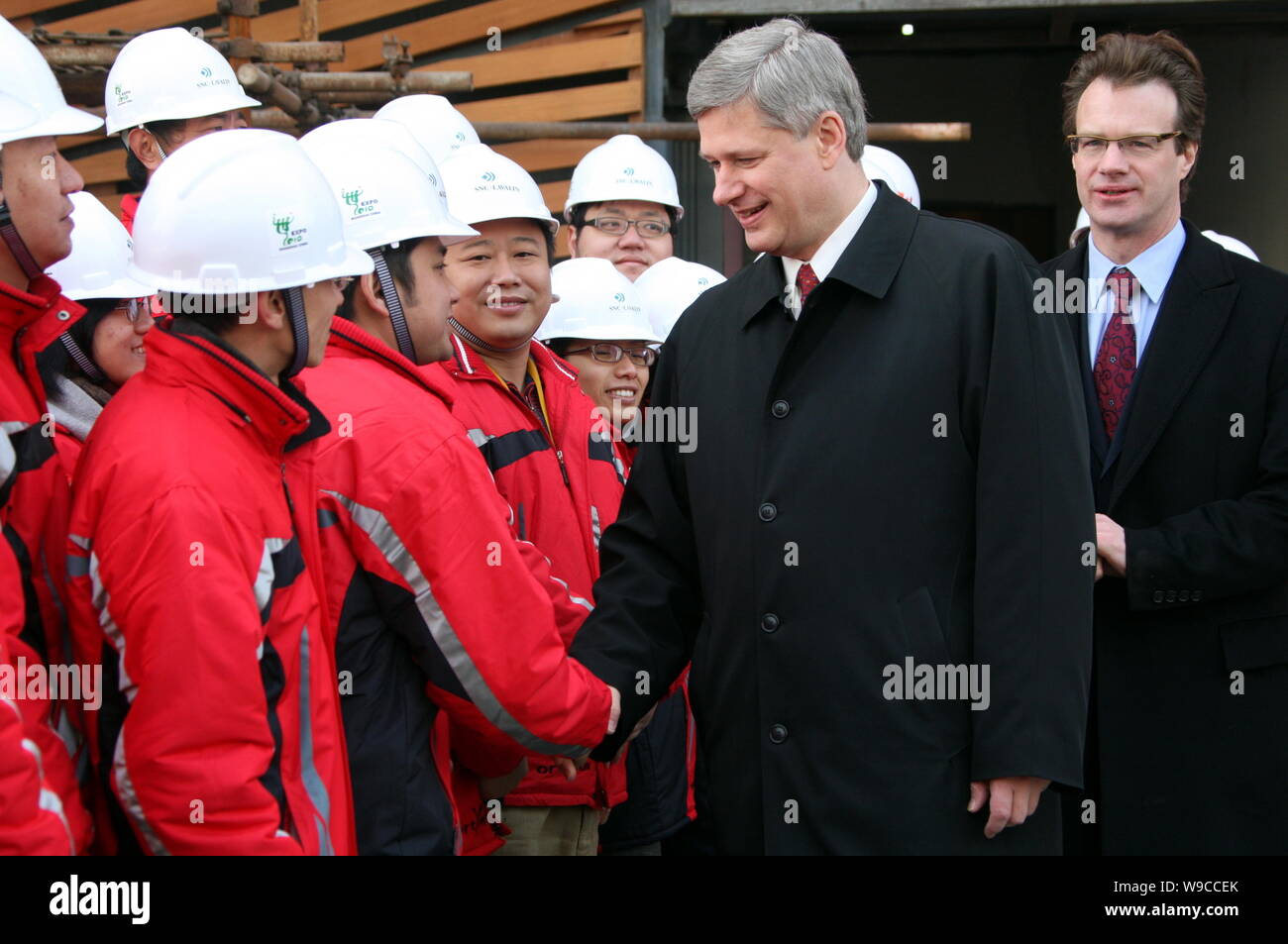 Canadian Prime Minister Stephen Harper, second right, shakes hands with ...