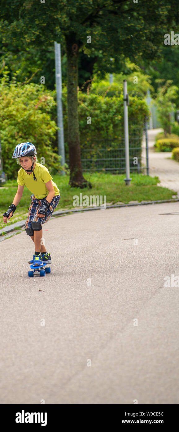Boy riding a skateboard Stock Photo - Alamy