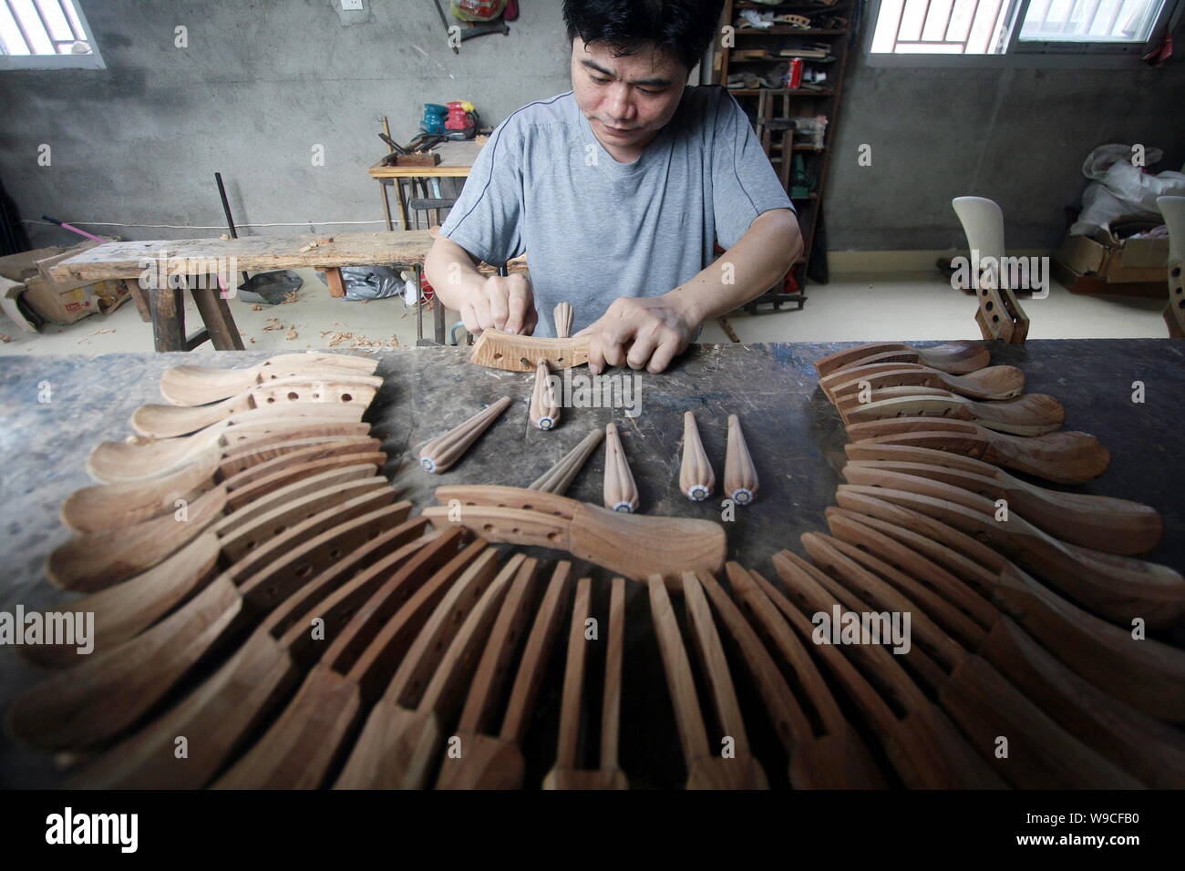 40-year-old craftsman Cai Dongpeng makes components of Nanyin pipas at ...