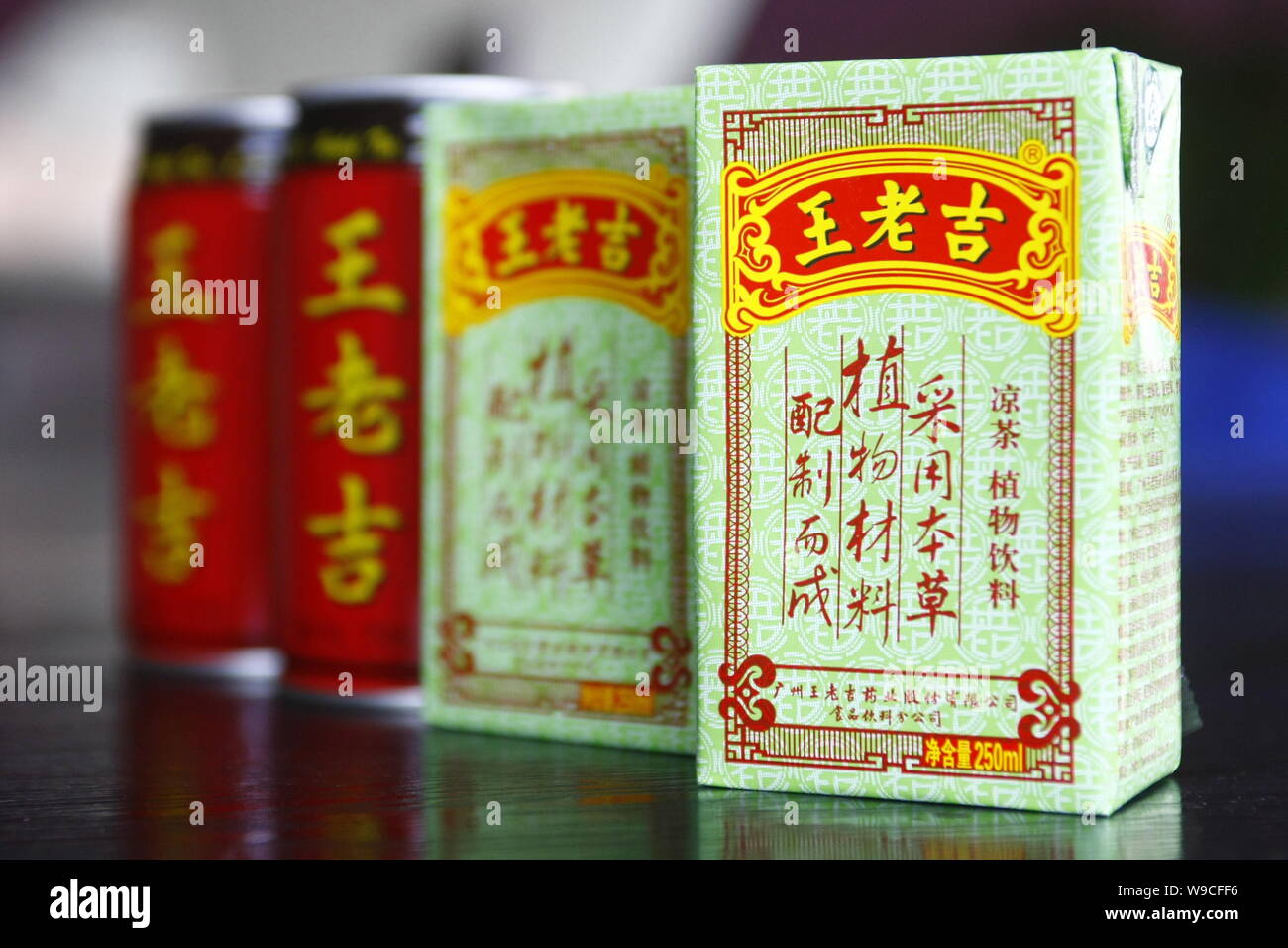 Boxes and tins of Wanglaoji herbal tea are seen in an office in ...
