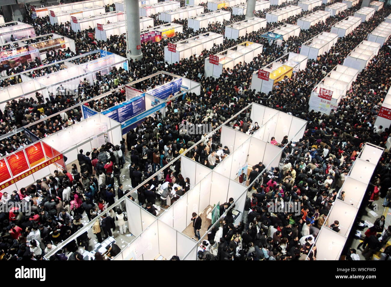 Chinese job seekers crowd stalls at a job fair in Chongqing, China ...