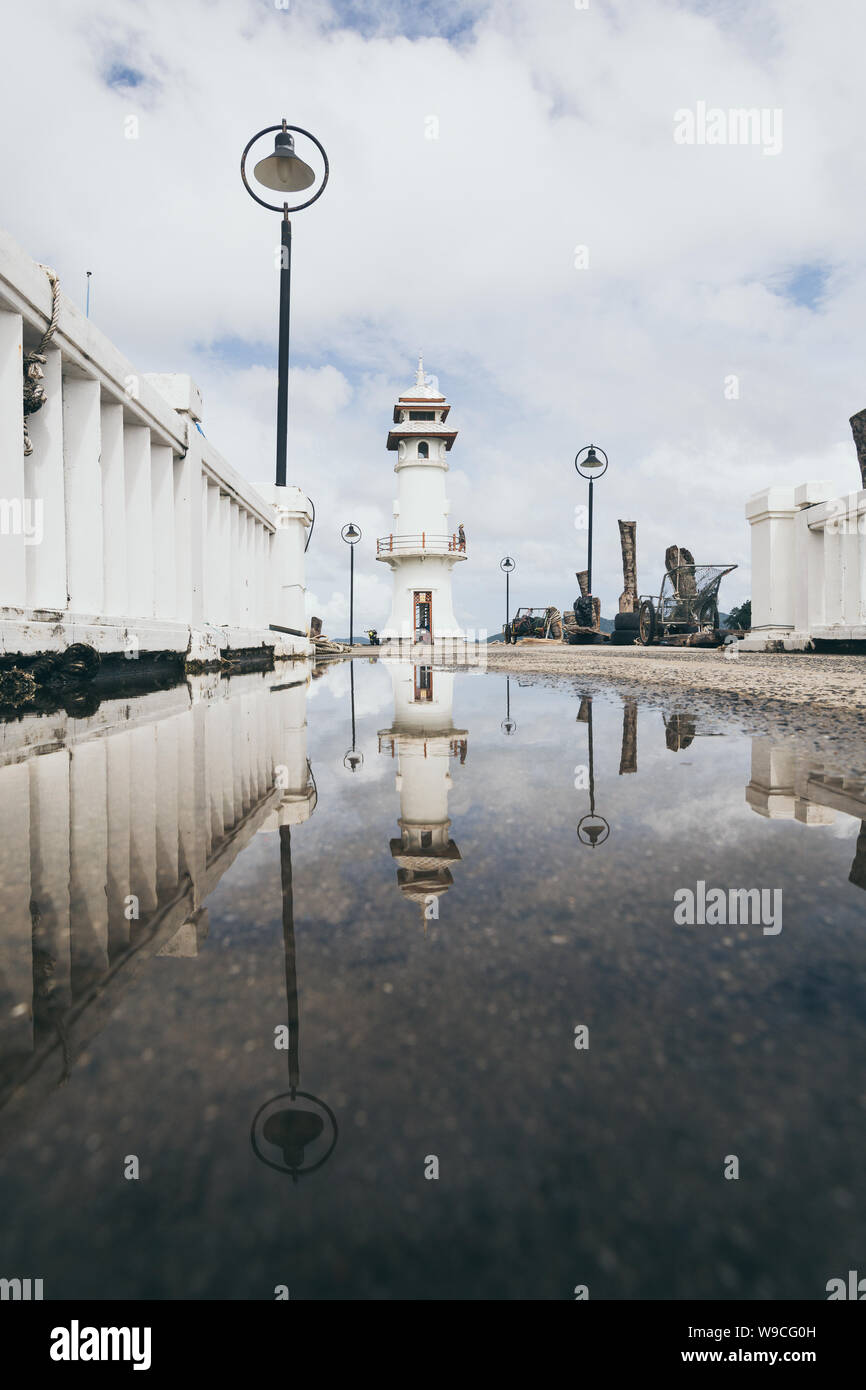 Lighthouse reflection in water, Baan Bang Bao fisherman village on Koh ...