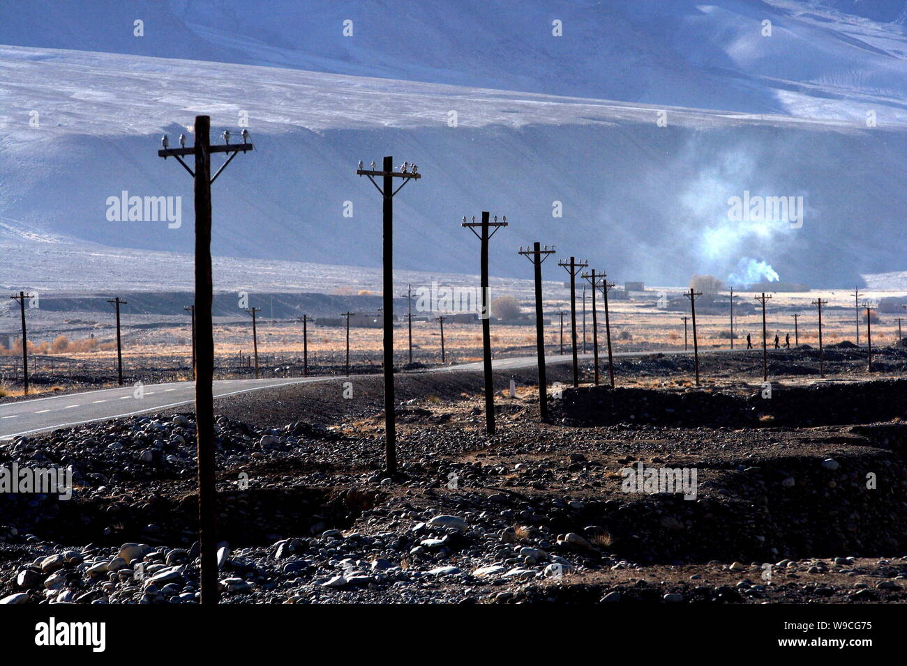 View of wooden telegraph poles along a highway in Tashkurgan Tajik ...