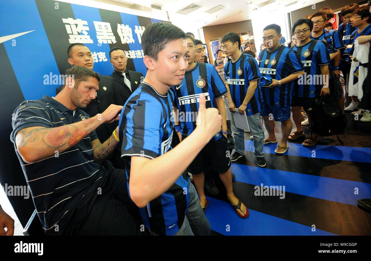 Marco Materazzi, left, and Ivan Ramiro Cordoba, unseen, of Inter Milan ...