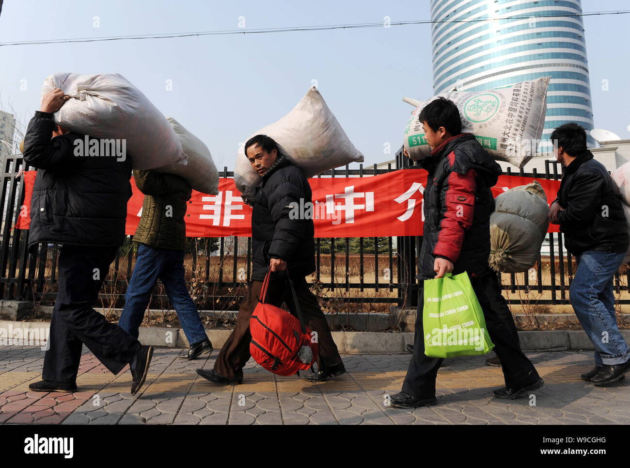 Chinese migrant workers walk in hi-res stock photography and images - Alamy