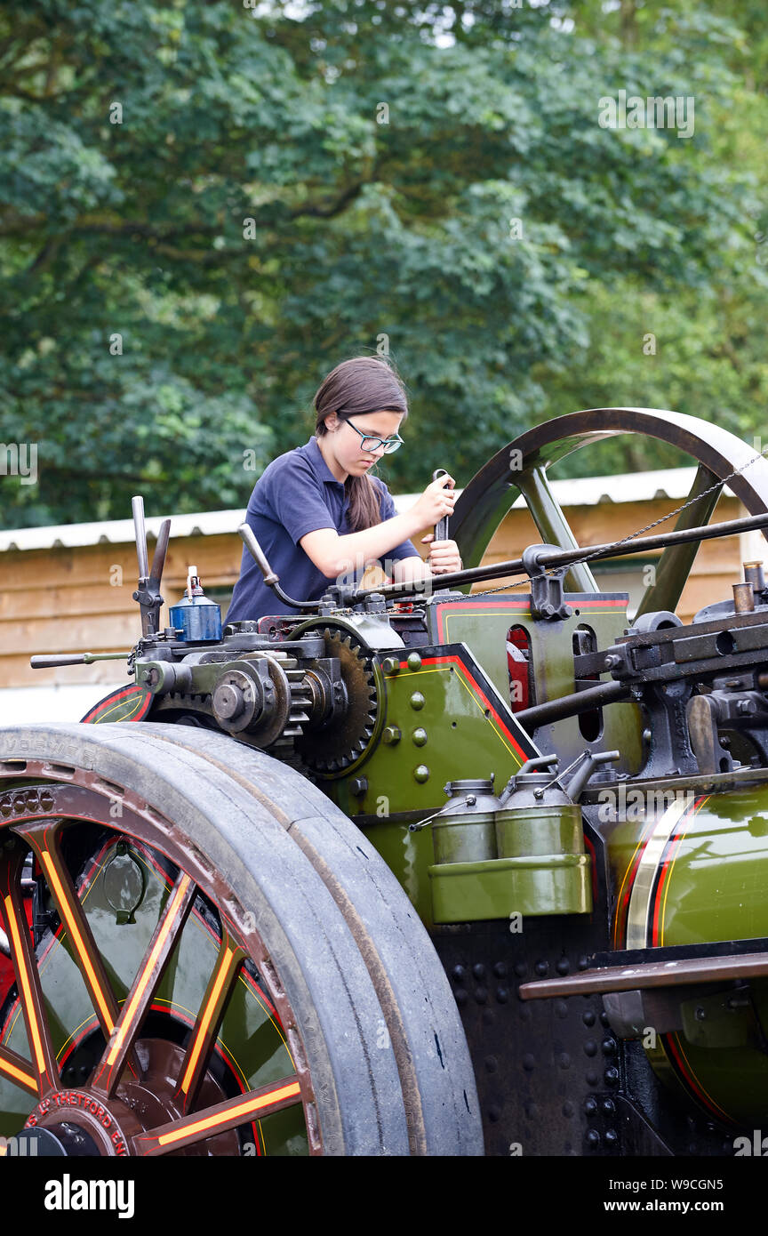 A Young teenage girl working on her traction engine a the Driffield ...