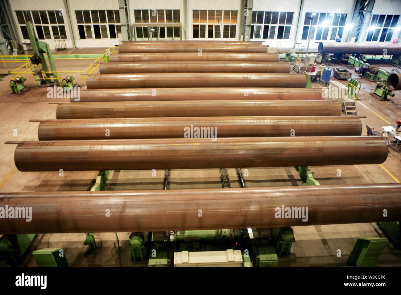 --FILE--Steel pipes are seen being manufactured at the factory of ...