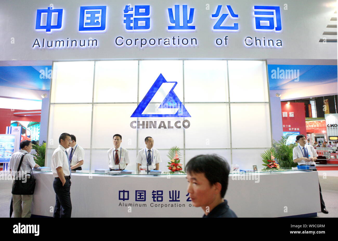 --FILE--Chinese staff and visitors are seen at the stand of Aluminum ...