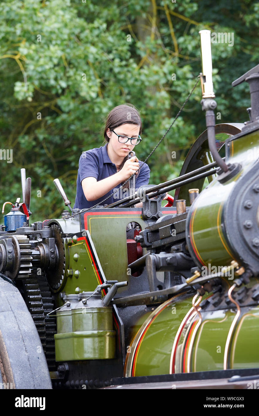 A Young teenage girl working on her traction engine a the Driffield ...