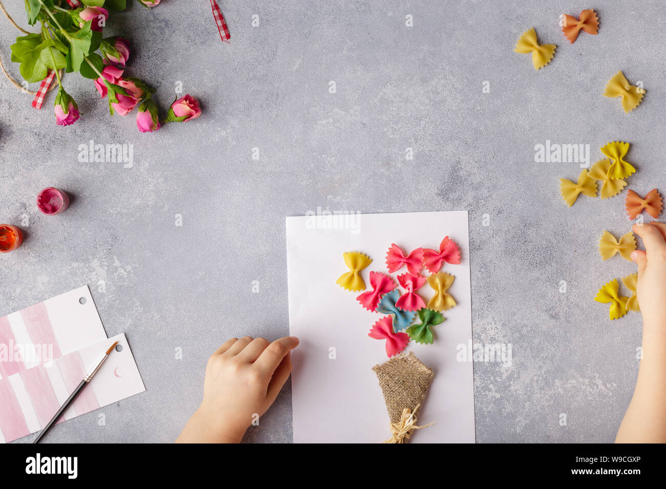 Paper crafts for mother day, 8 march or birthday. Small child doing a ...