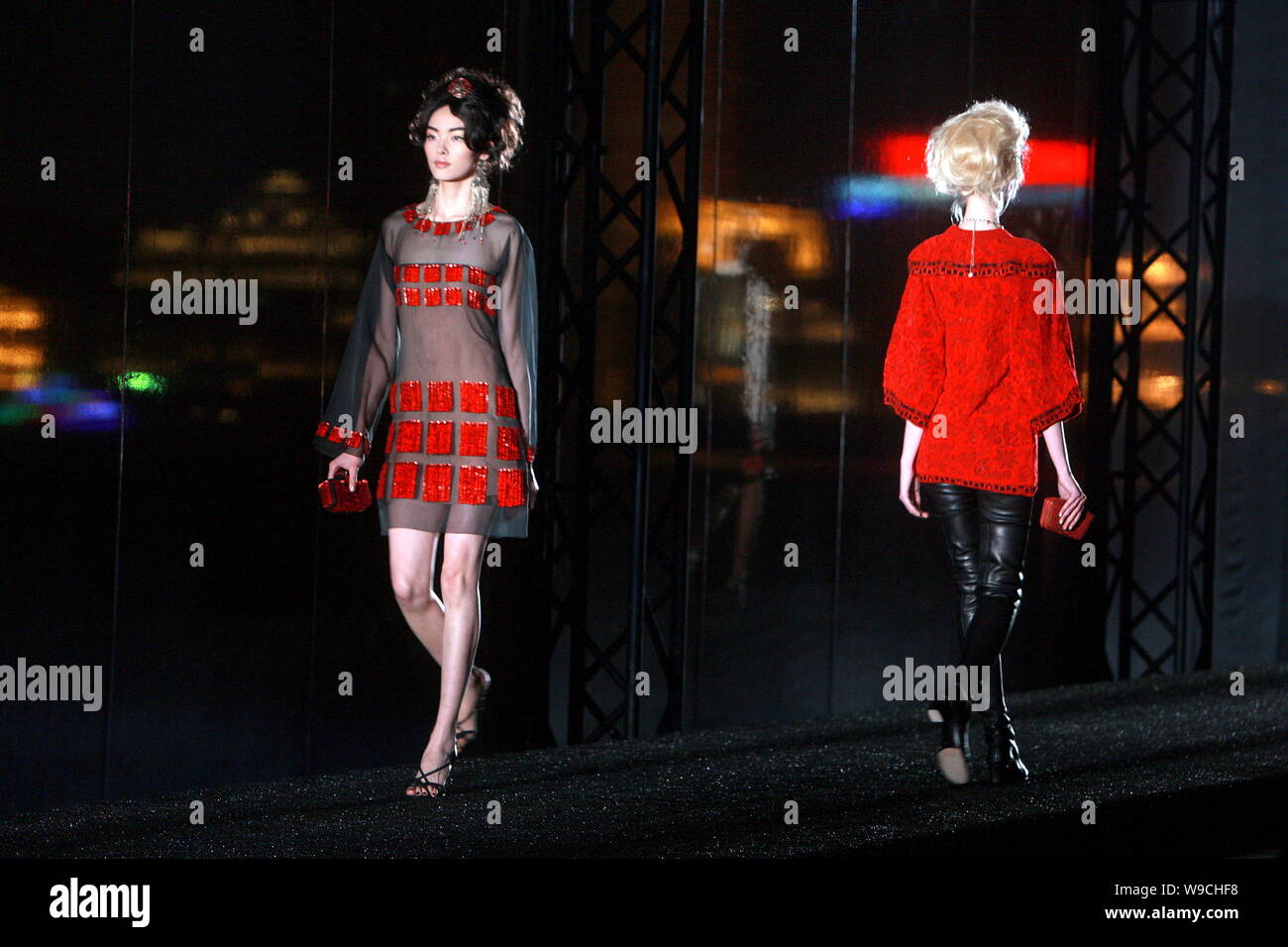 Chinese model Sun Feifei, left, and another model parade to display the ...