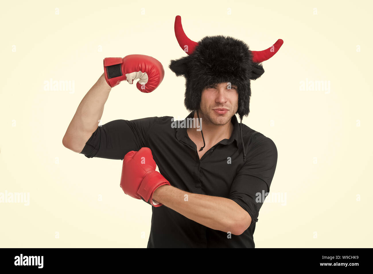 Animal power. Masculinity concept. Man with horns as devil or bull wear ...